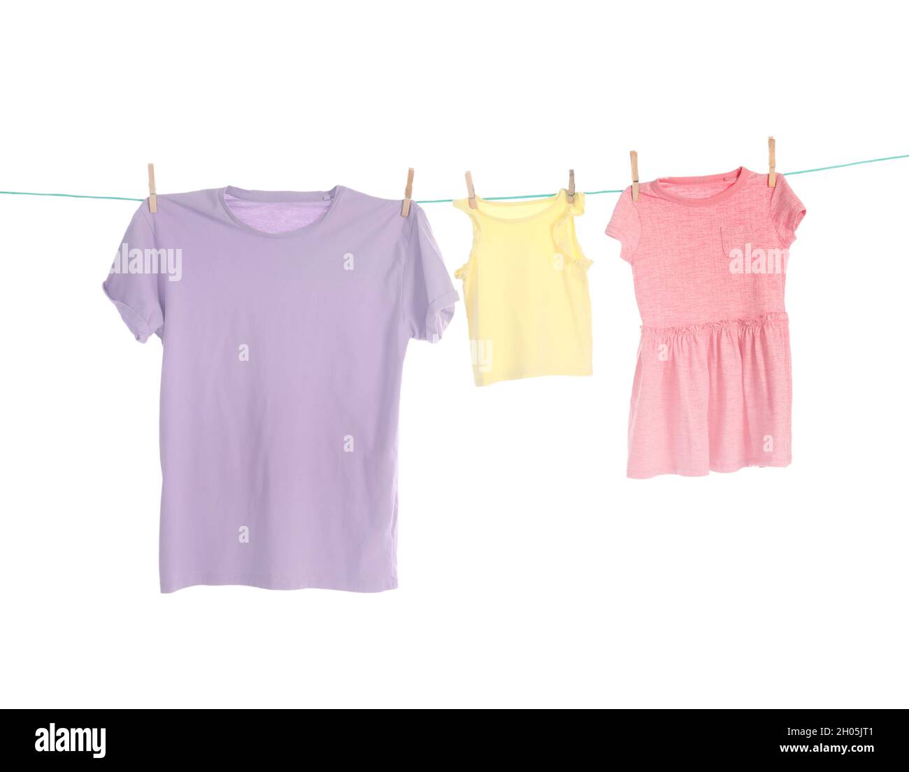 Clothes on laundry line against white background Stock Photo - Alamy