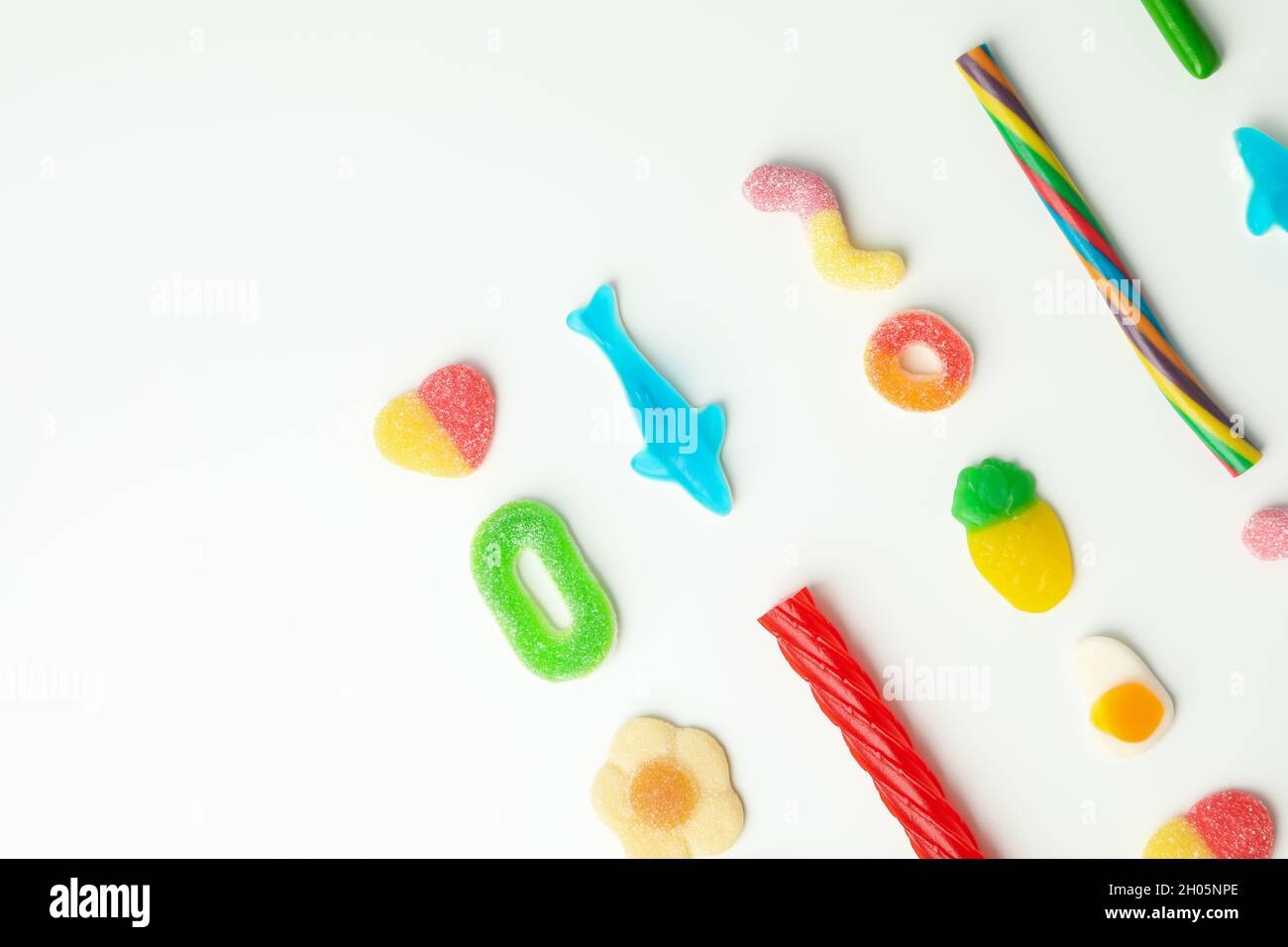 Gummy candies on white background, space for text Stock Photo - Alamy