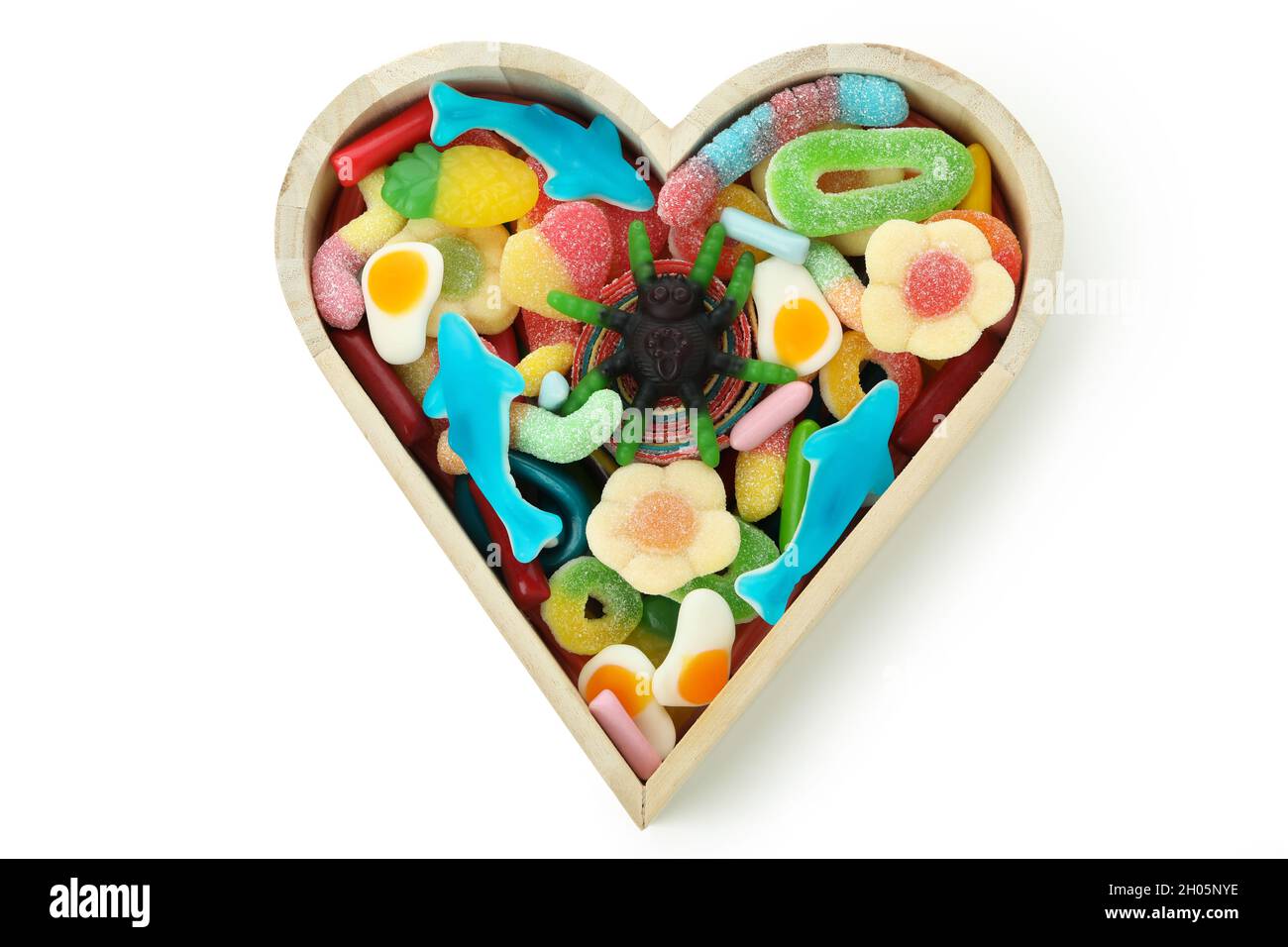 Wooden heart with gummy candies isolated on white background Stock ...