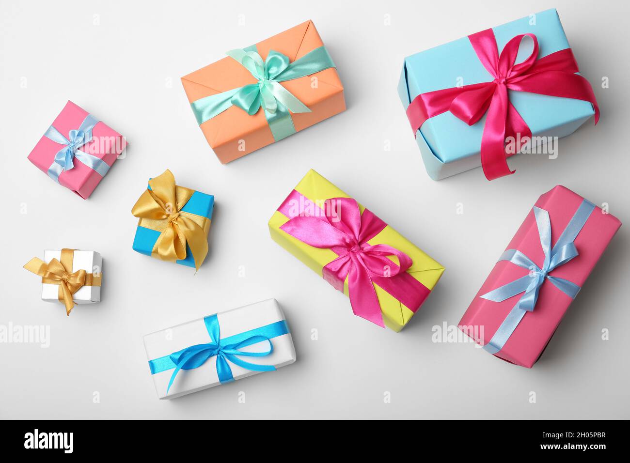Flat lay composition with beautiful gift boxes on white background ...