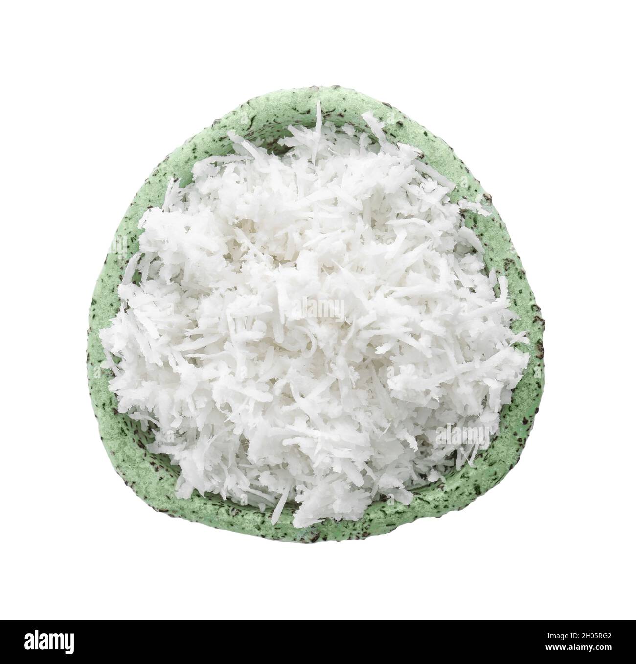 Fresh coconut flakes in bowl on white background, top view Stock Photo ...