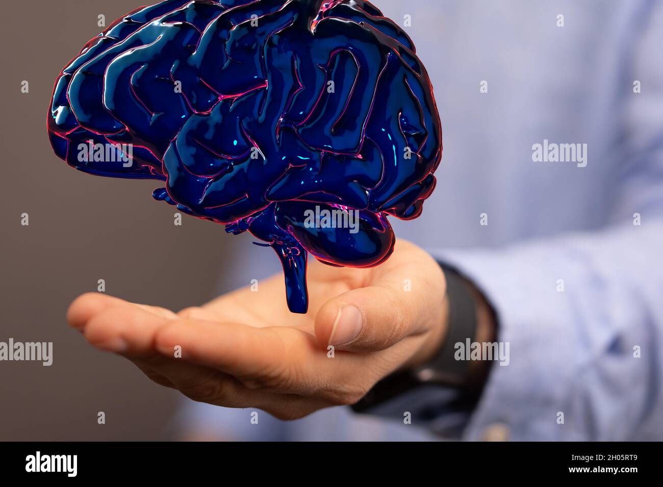 3D illustration of a blue brain floating on a man hand Stock Photo - Alamy