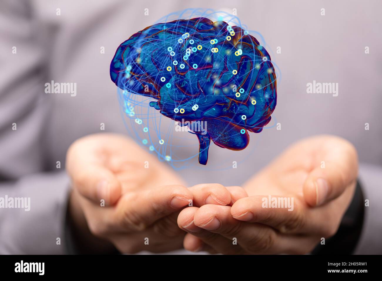 3D illustration of a blue brain floating on a man hand Stock Photo - Alamy