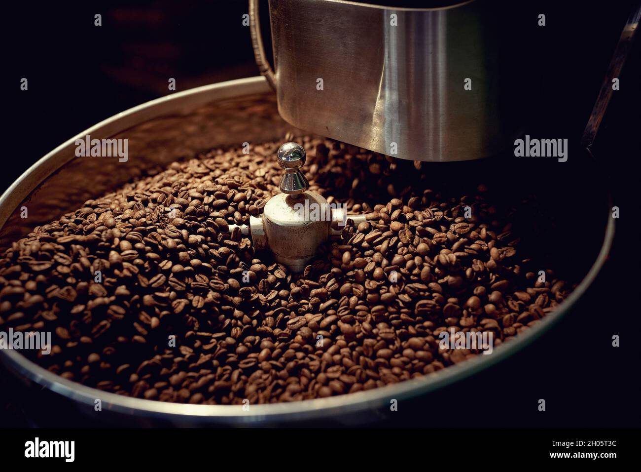 Mixing process during coffee roasting in the machine Stock Photo - Alamy