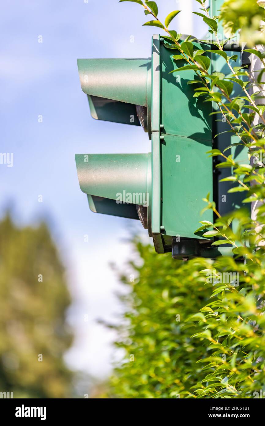 Vertical shot of a green traffic light for pedestrians Stock Photo - Alamy