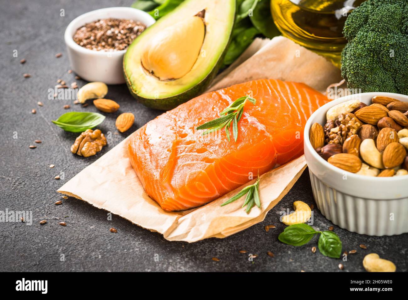 Healthy fats products at black background Stock Photo - Alamy