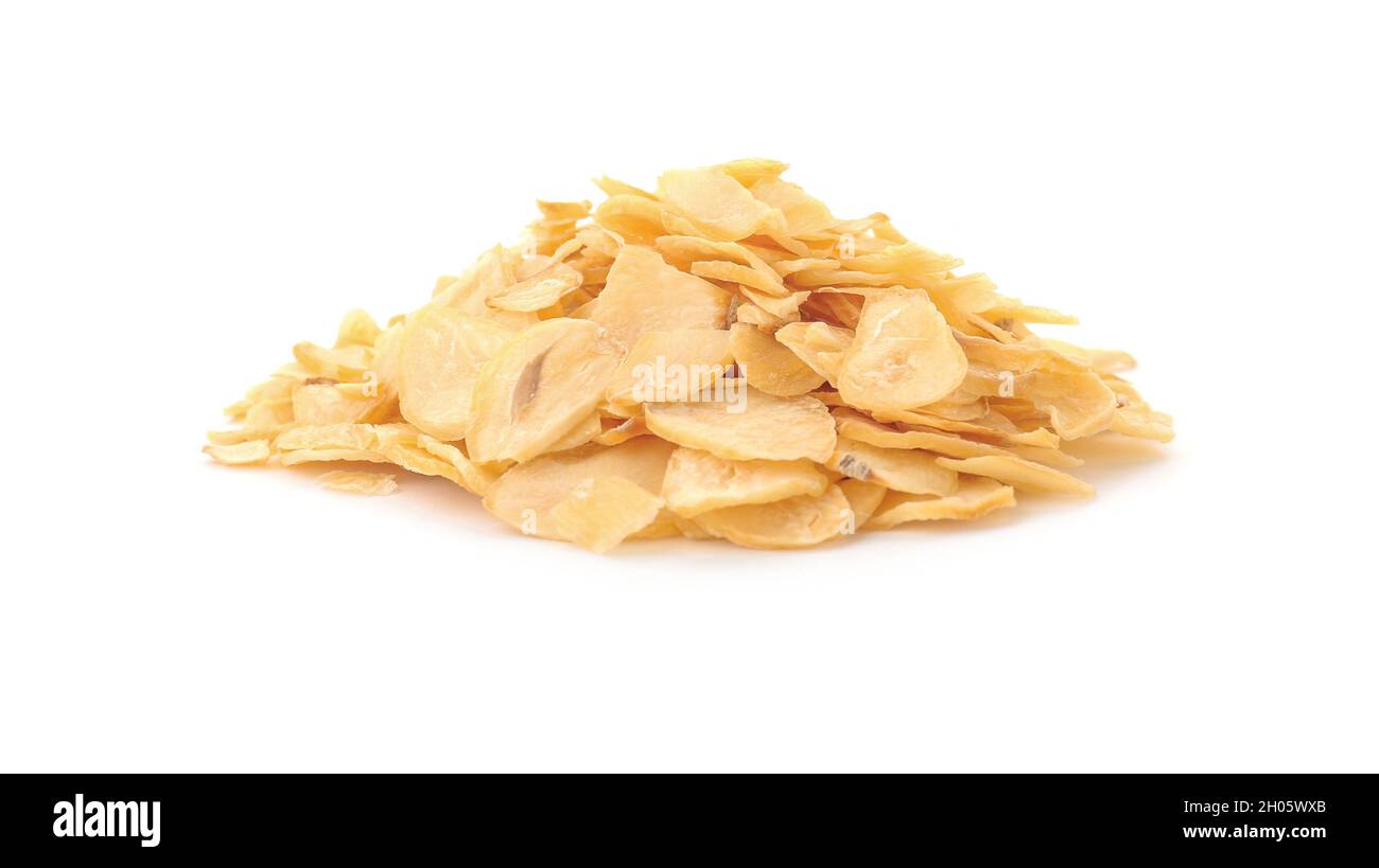 Pile of dried garlic flakes on white background Stock Photo - Alamy