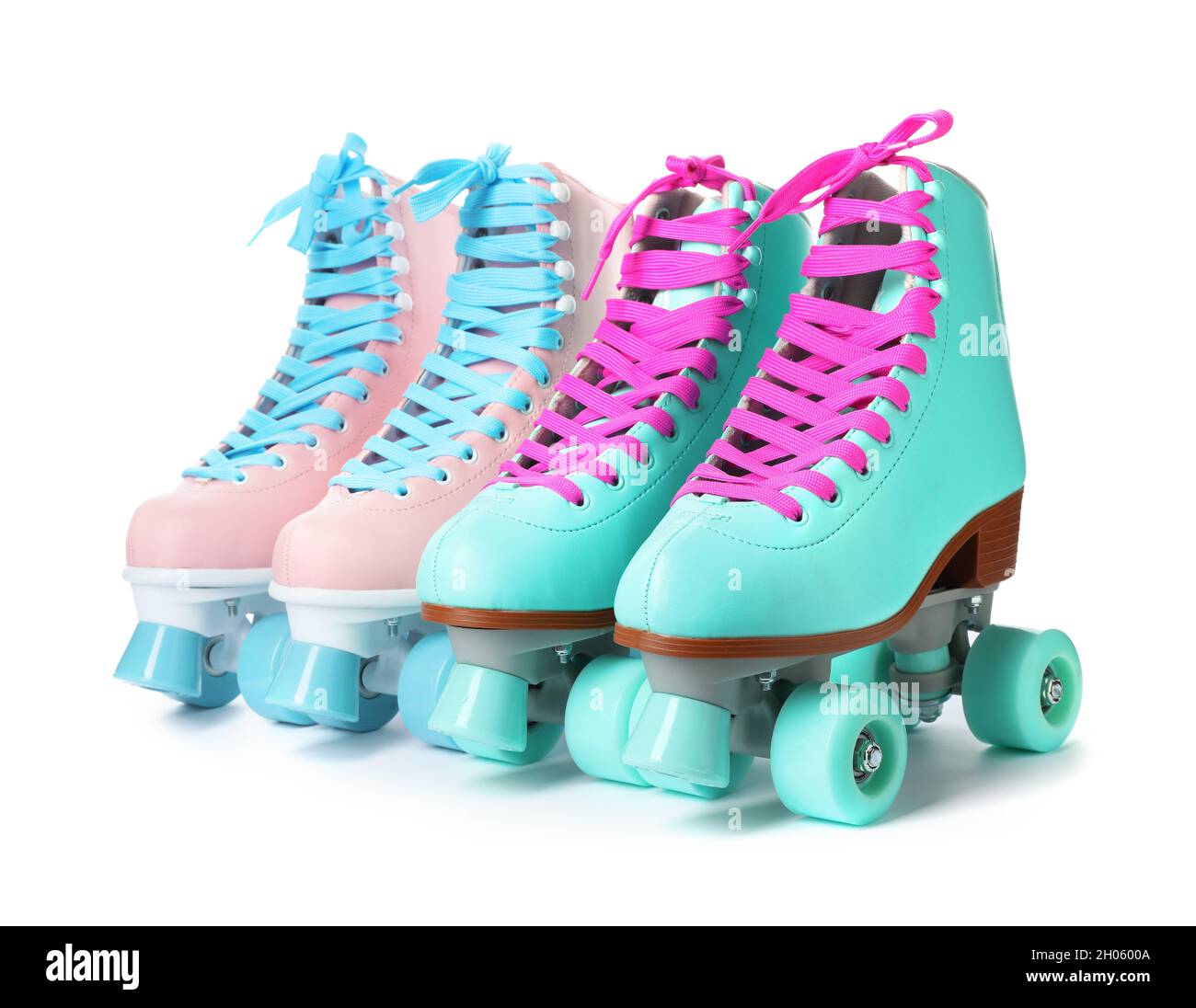 Pairs of bright stylish roller skates on white background Stock Photo ...