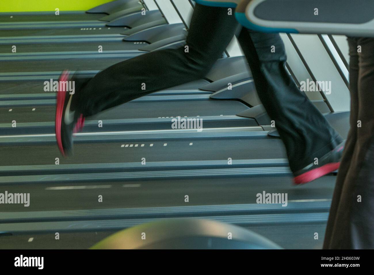 Runners using a running machines in a Leisure Centre Stock Photo - Alamy
