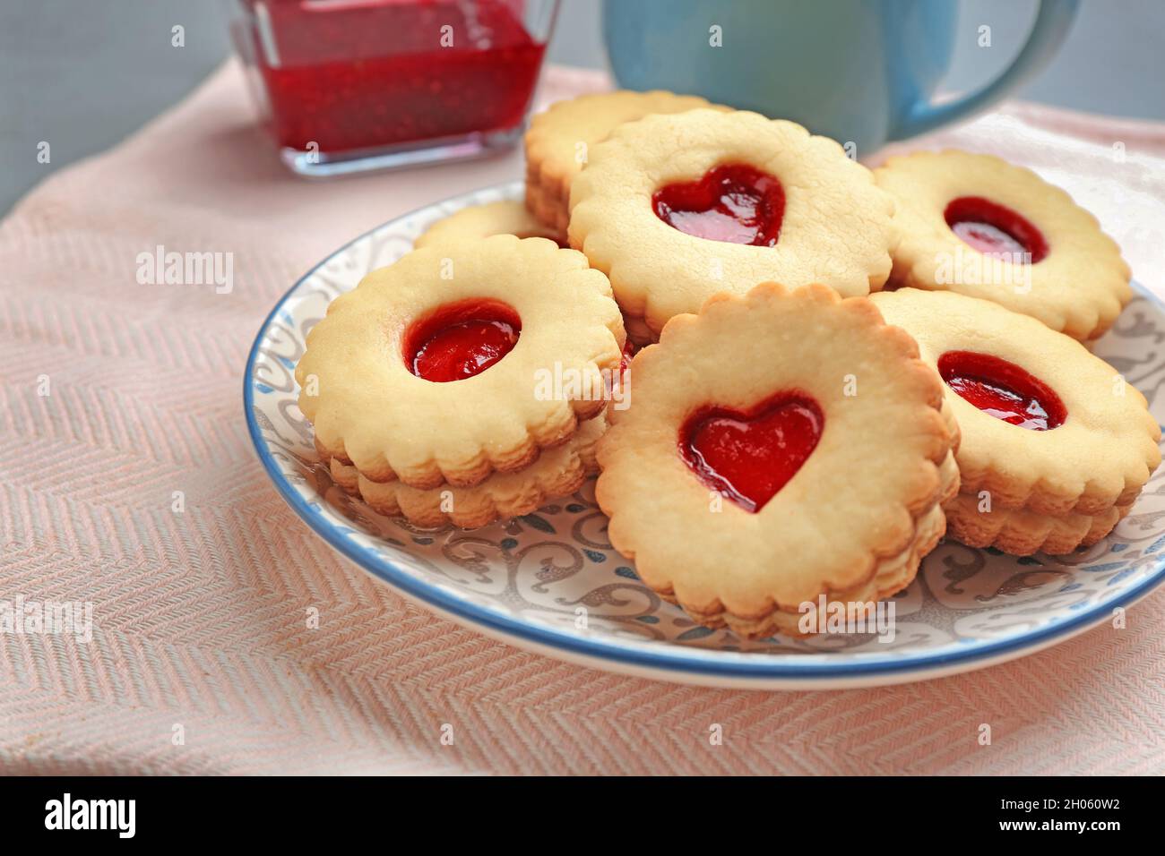 Traditional Christmas Linzer cookies with sweet jam on plate Stock ...
