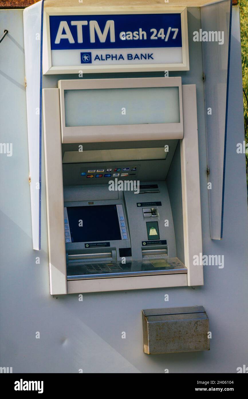 Santorini, Fira, Greece - October 10, 2021 ATM located in the streets ...
