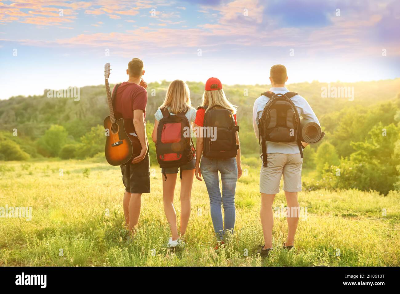 Young people backpacking guitar hi-res stock photography and images - Alamy