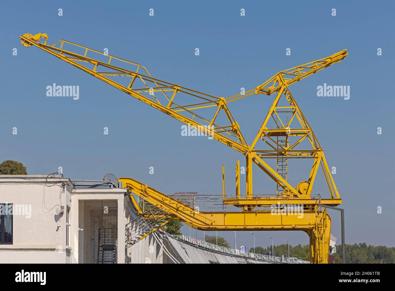 Yellow Crane Steel Boom Structure at Port Warehouse Stock Photo - Alamy