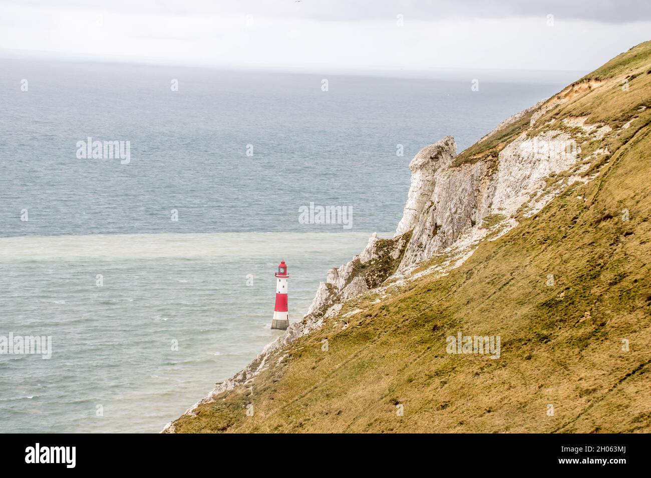 Beachy Head Lighthouse located in the English Channel below the cliffs ...