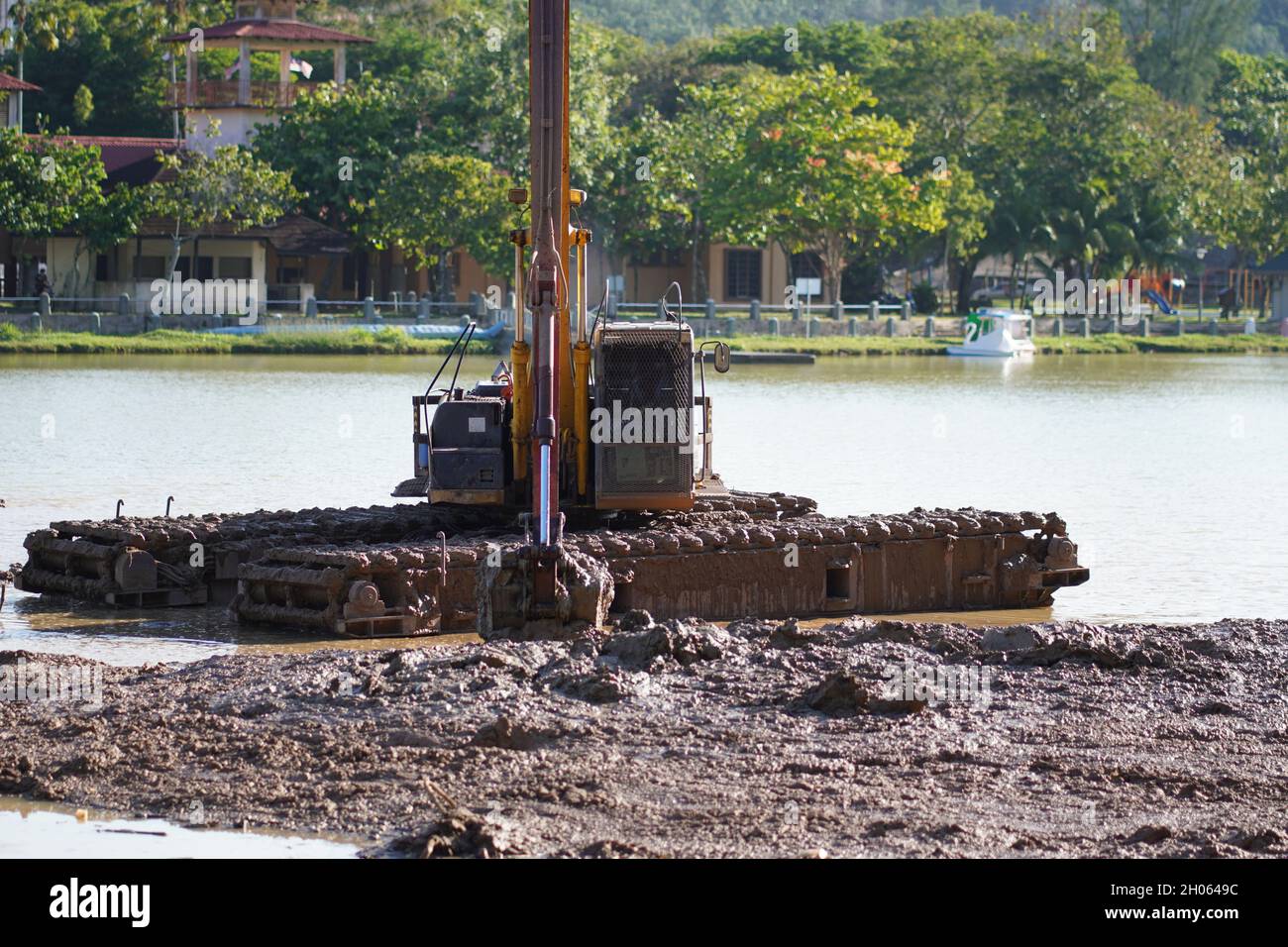 Land and Water Dredging Excavator with Amphibious Excavator working in ...