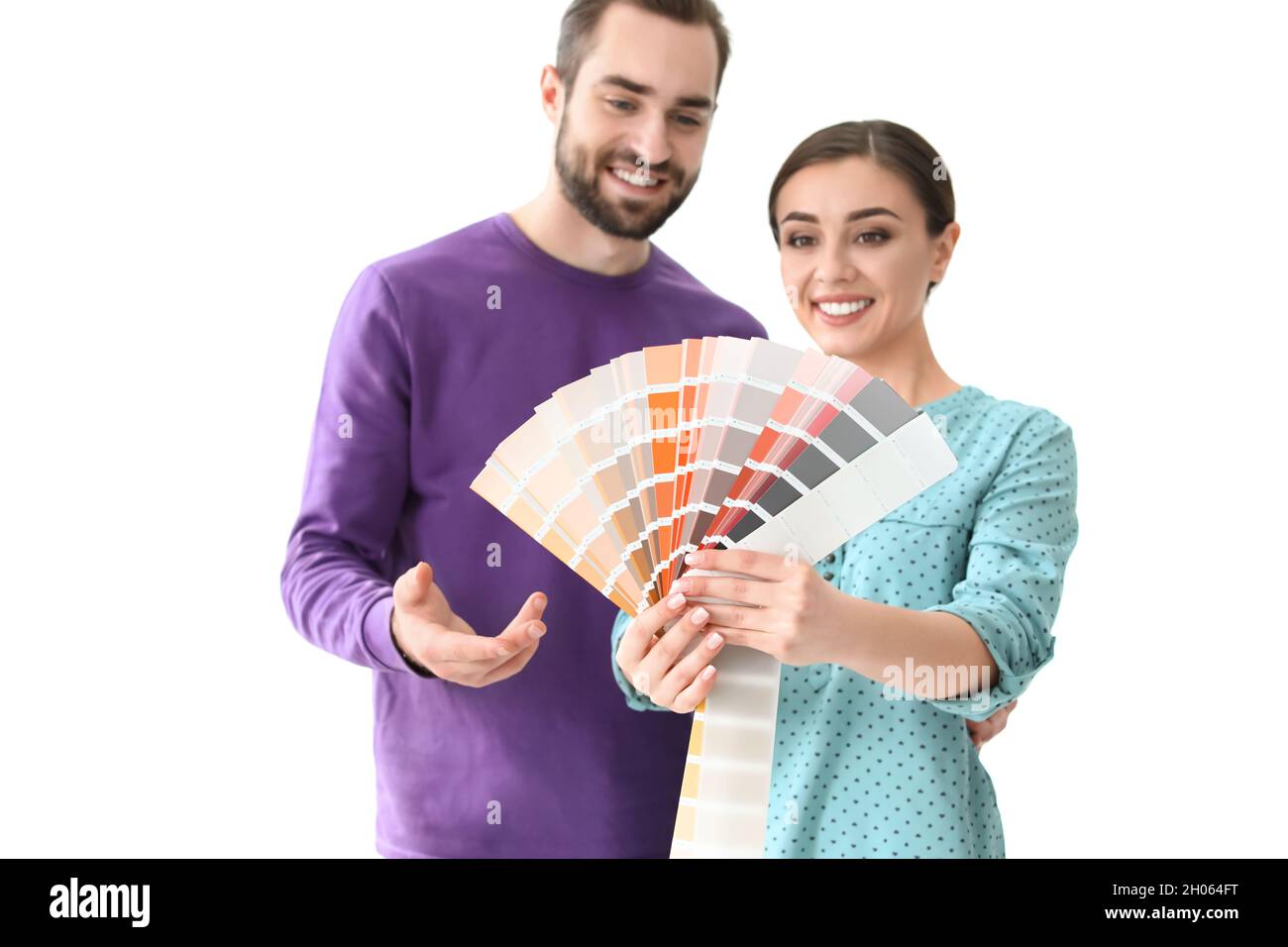 Young couple with color palette on white background Stock Photo - Alamy
