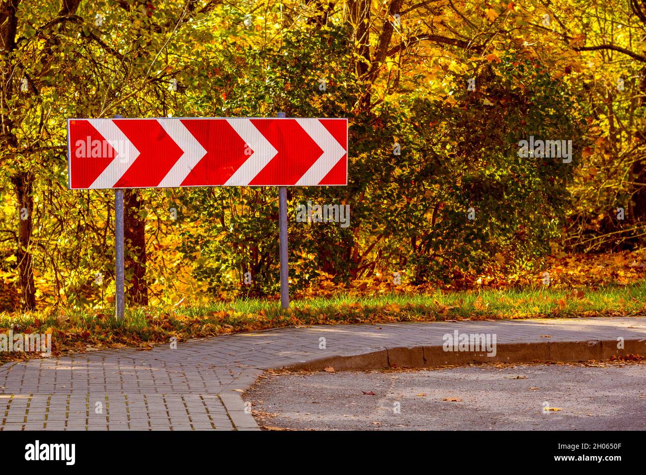 Traffic sign with arrows indicating dangerous curve to the right Stock ...