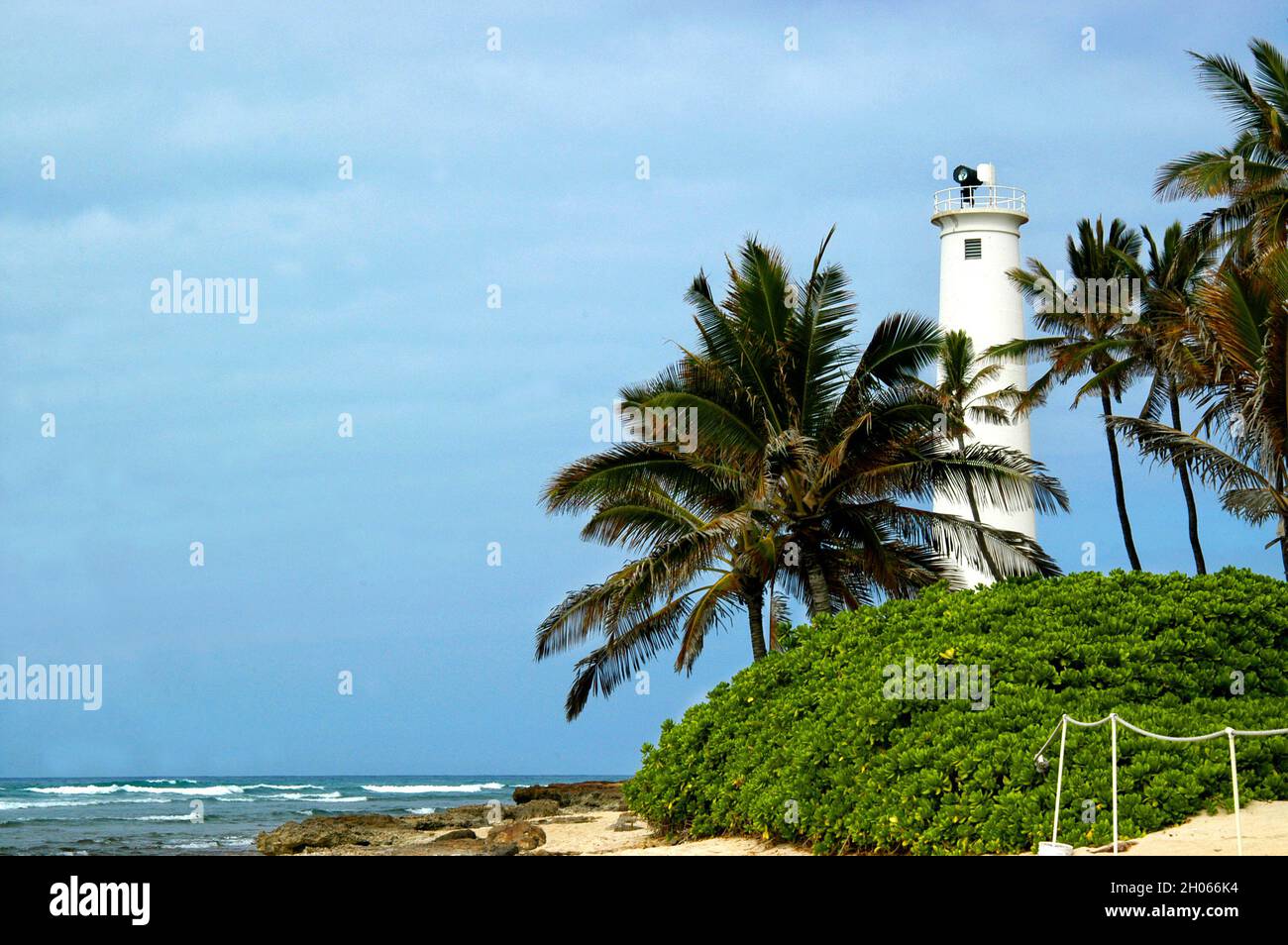 Rugged sandy beach sits besides Barber's Point Lighthouse on the island ...