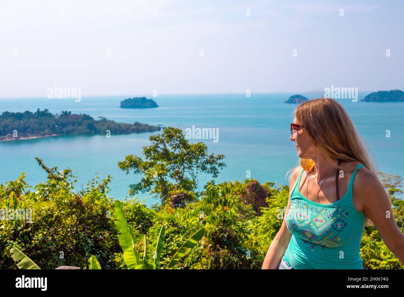girl looks at the sea island on the observation deck Stock Photo - Alamy