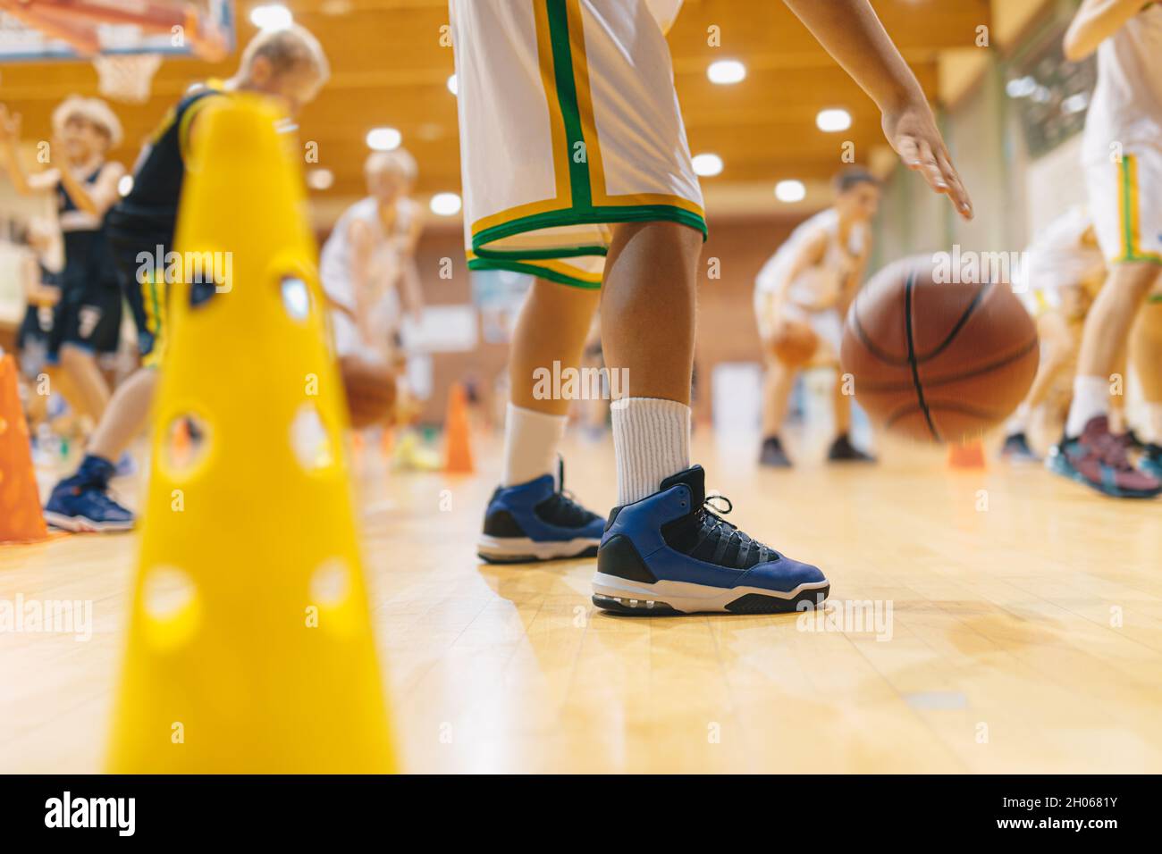 Young School Boys Practicing Bouncing Basketballs on School Wooden ...