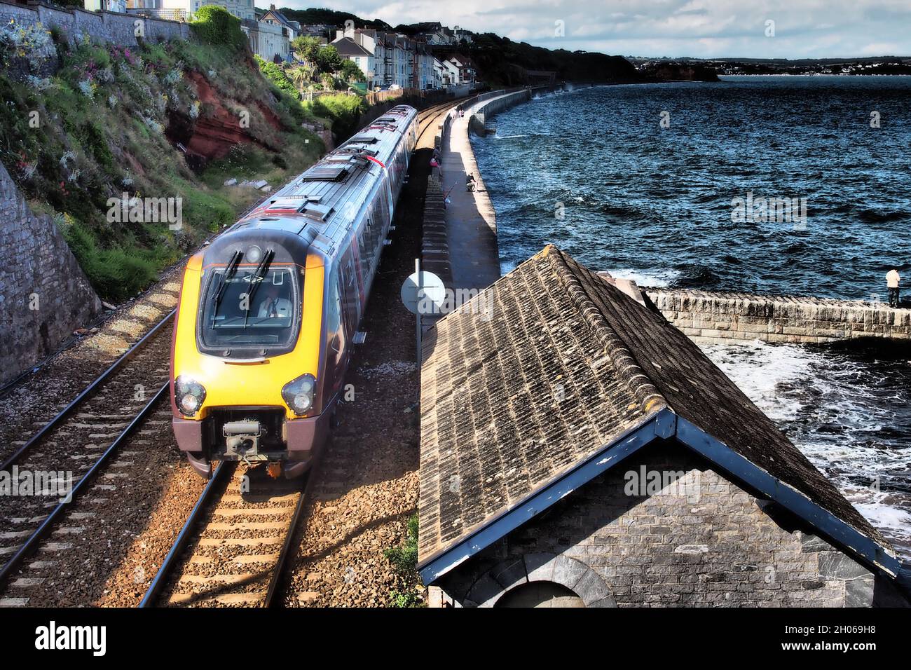 High speed train alongside sea wall at Dawlish, South Devon Stock Photo ...