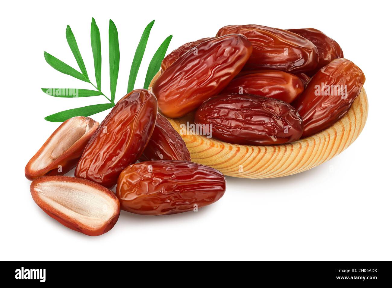 Dates in wooden bowl isolated on white background with clipping path ...