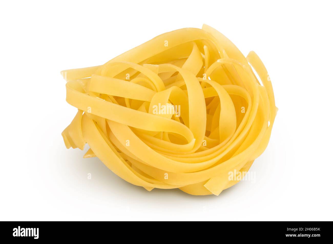 Raw tagliatelle pasta isolated on white background with clipping path ...
