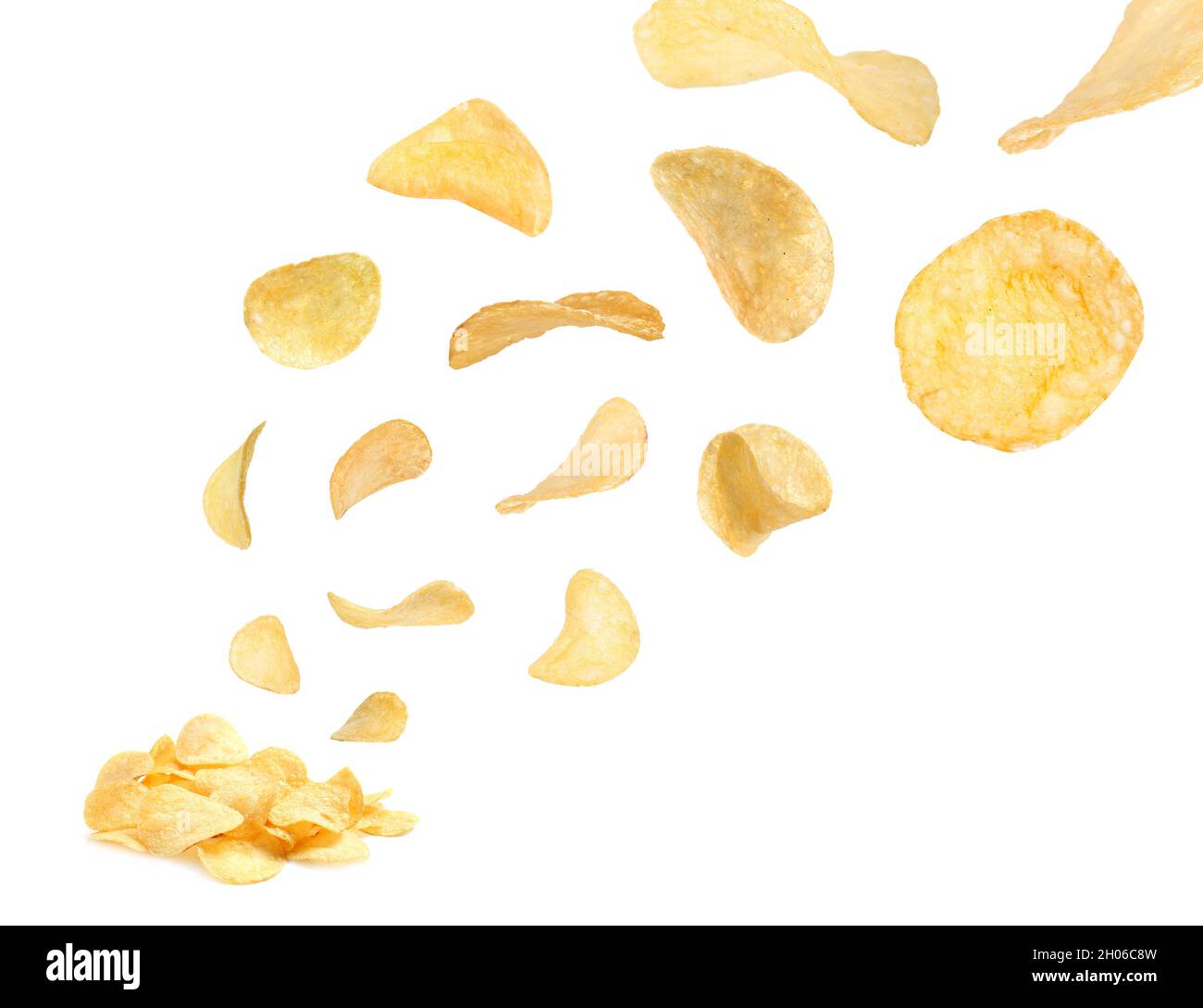 Tasty potato chips falling on white background Stock Photo - Alamy