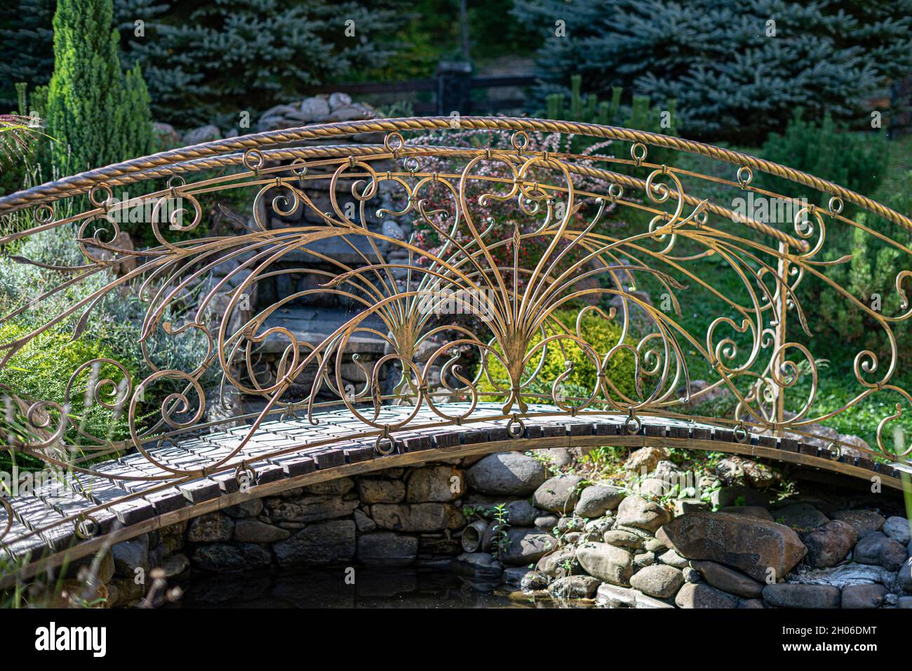 Forged bridge in the park Stock Photo - Alamy