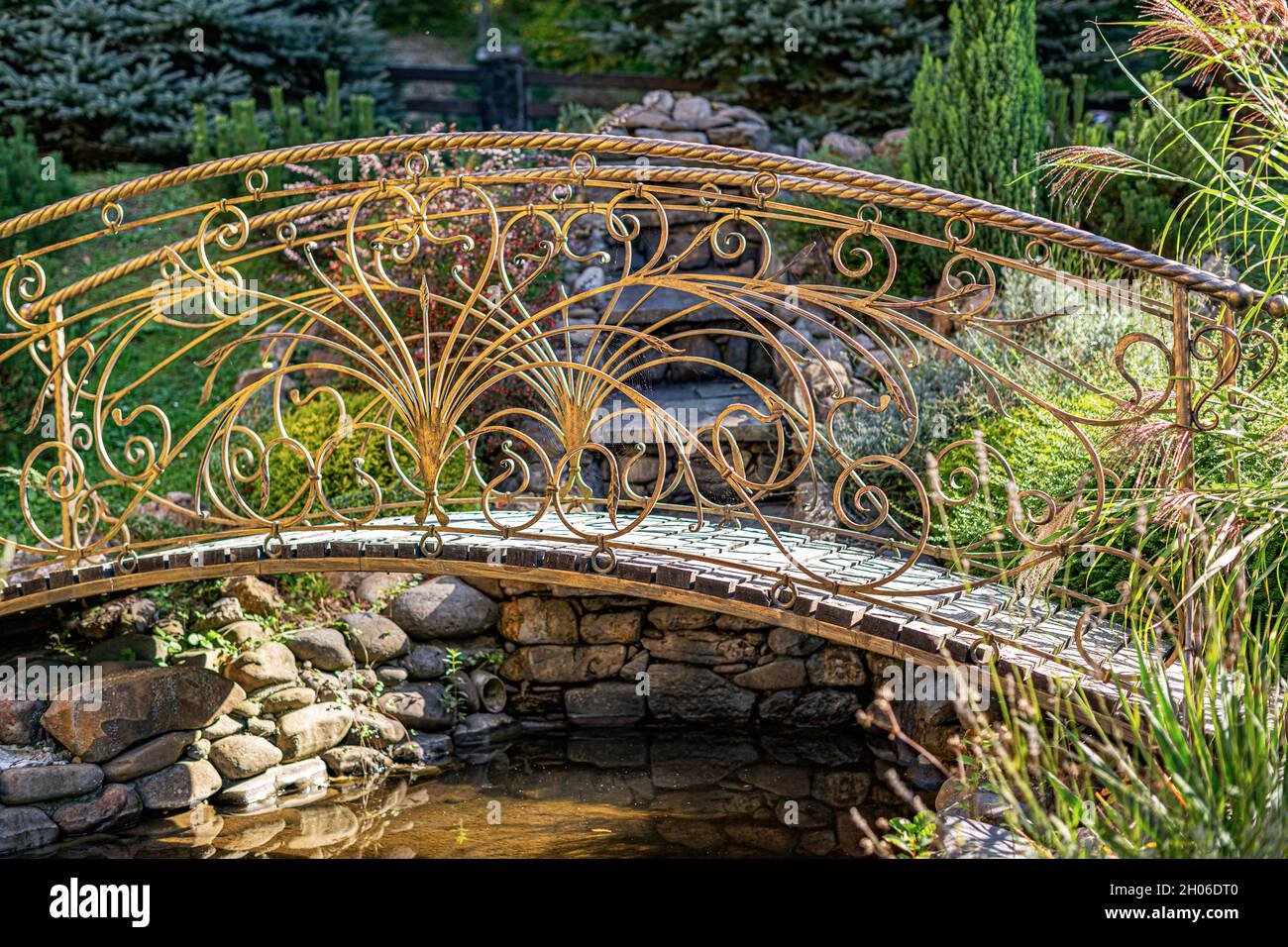 Forged bridge in the park Stock Photo - Alamy