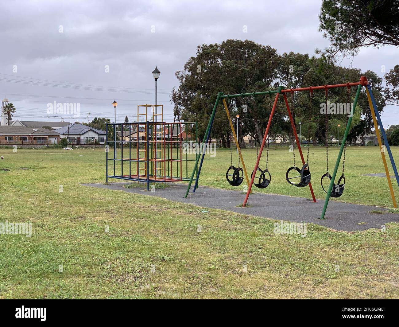 Playground with pine tree Stock Photo - Alamy