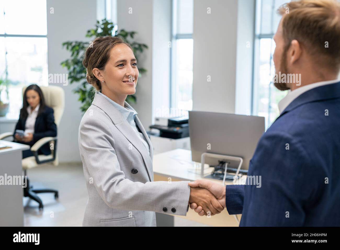 Two happy colleagues in formalwear hi-res stock photography and images ...