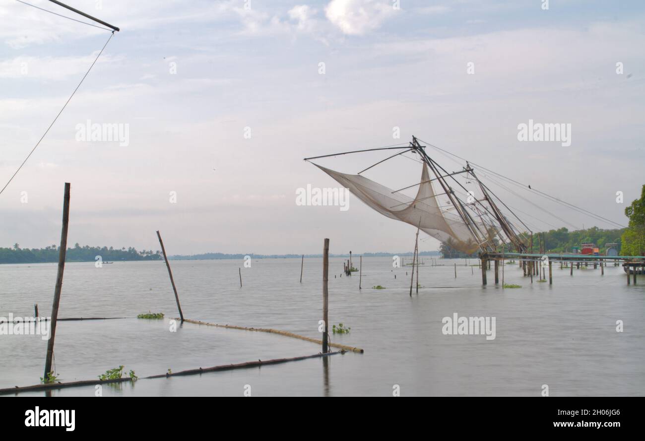 View of the fishing nets in a lake , pictured from different angles ...