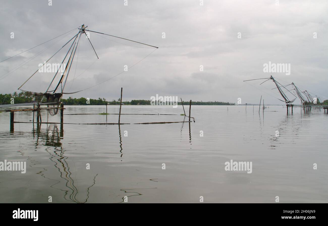 View of the fishing nets in a lake , pictured from different angles ...