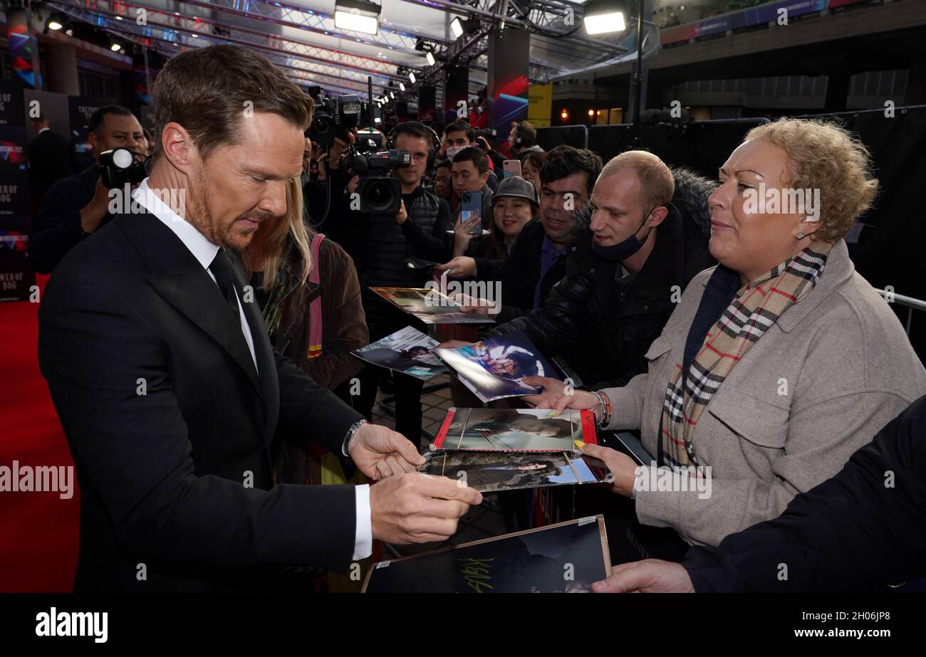 Benedict Cumberbatch signs photos as he arrives for the UK premiere of ...