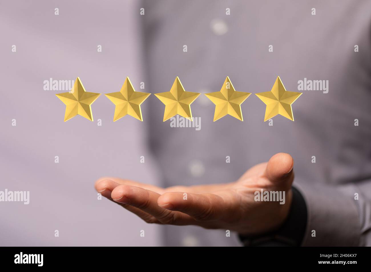 3D rendered star icons with a male's hand in the background Stock Photo ...