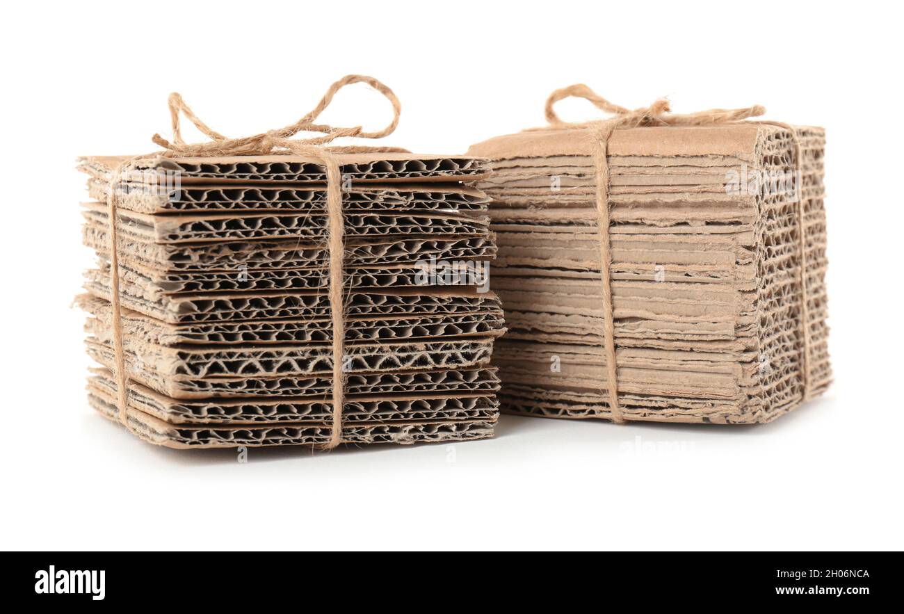 Stacks of cardboard pieces on white background. Recyclable material ...