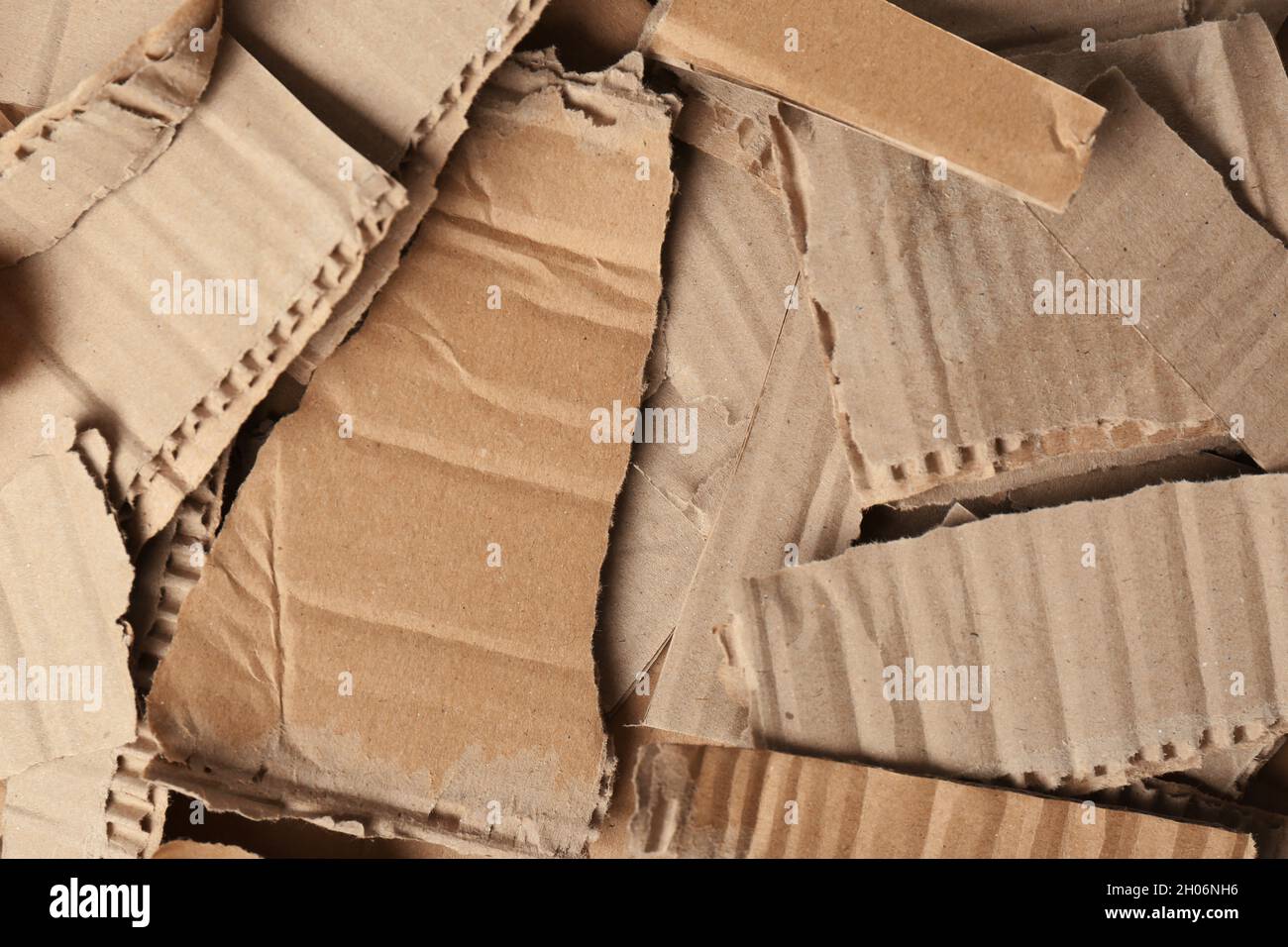 Pieces of brown cardboard as background, top view. Recyclable material ...