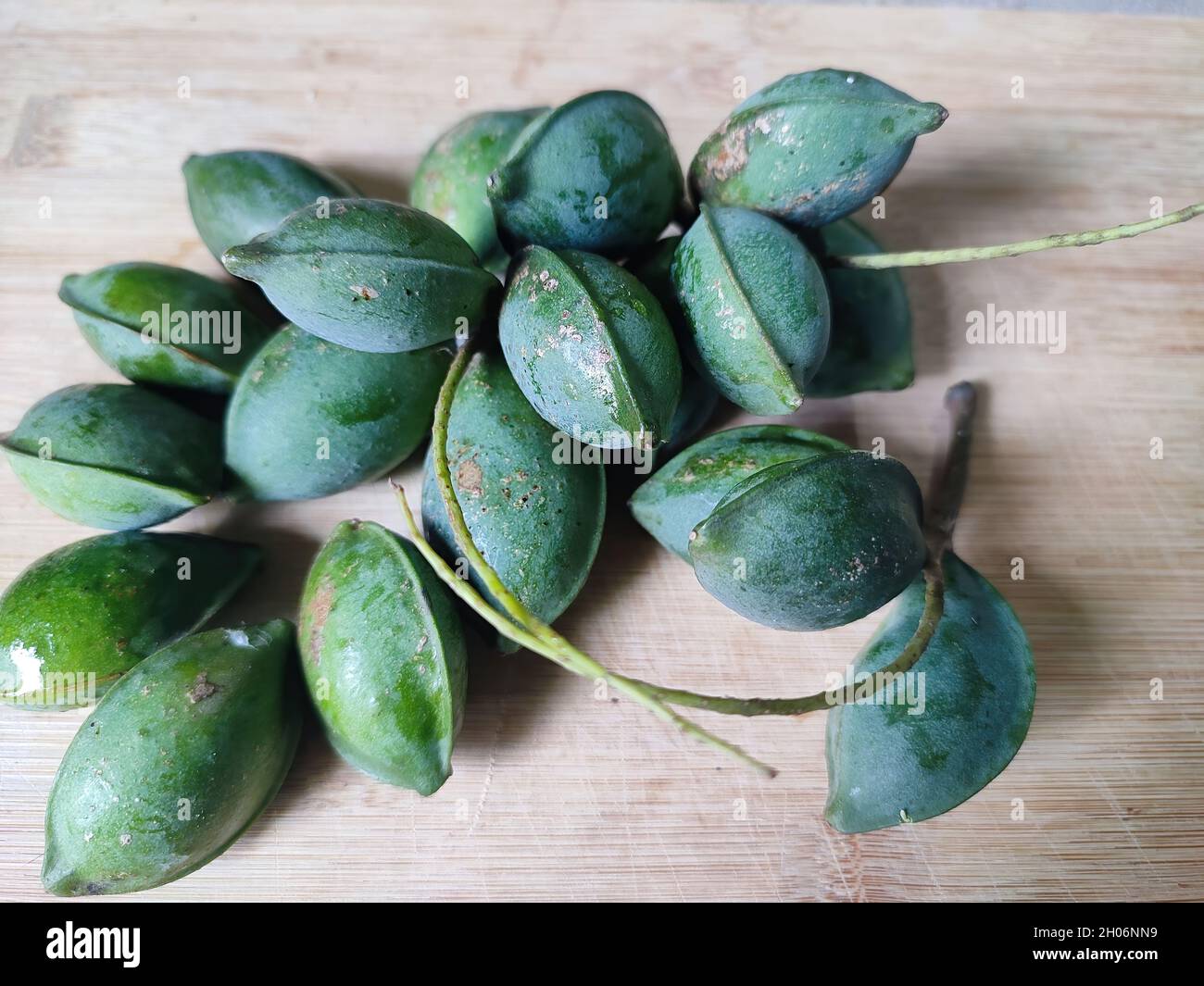 Closeup shot of fresh raw Indian almonds on a wooden table Stock Photo ...