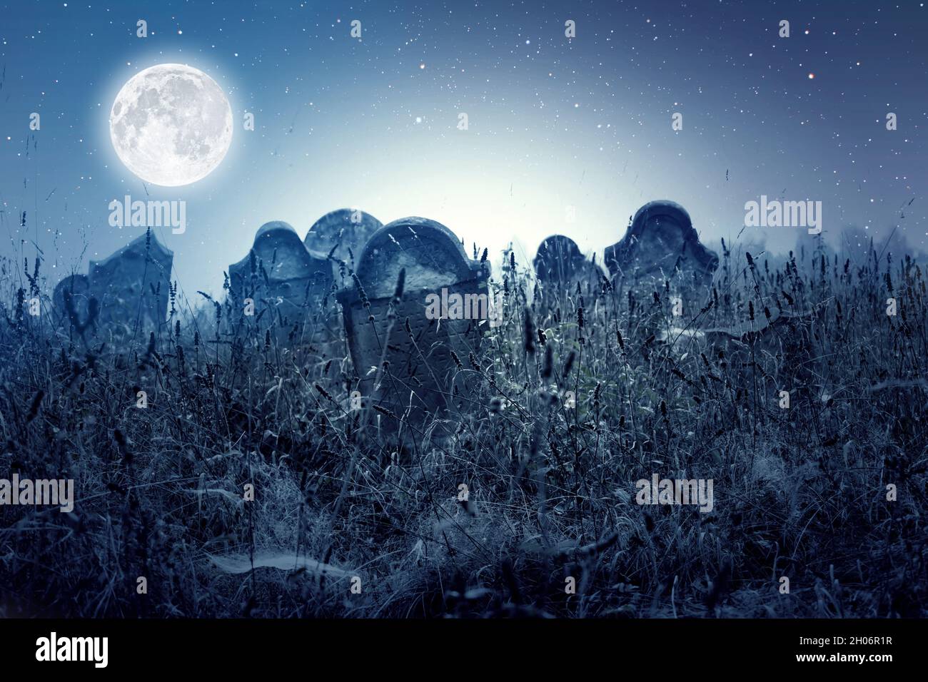 Tombstones in cemetery at night with full moon. Halloween concept Stock ...