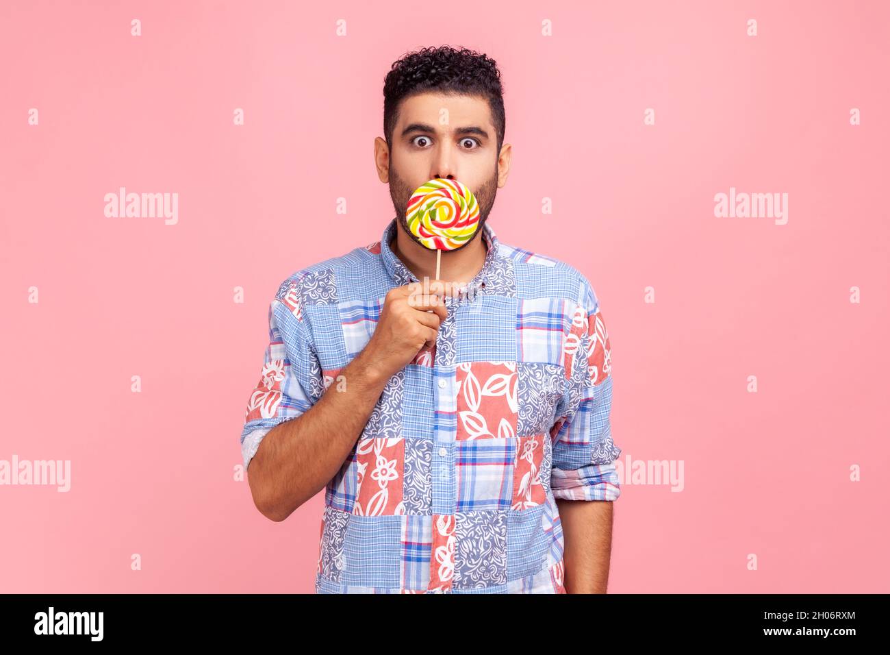 Indian man eating sweet hi-res stock photography and images - Alamy
