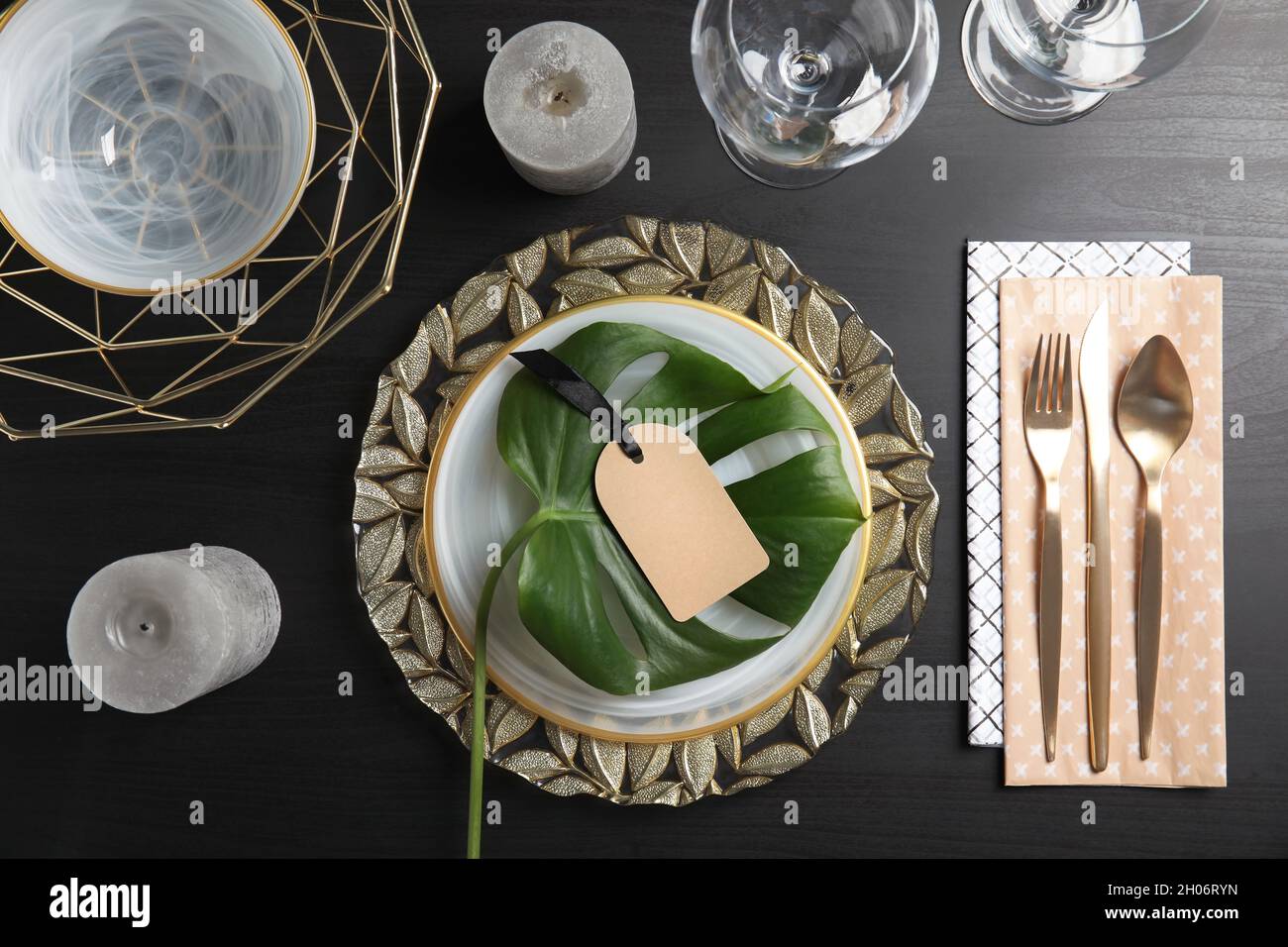Elegant table setting on dark background, top view Stock Photo - Alamy