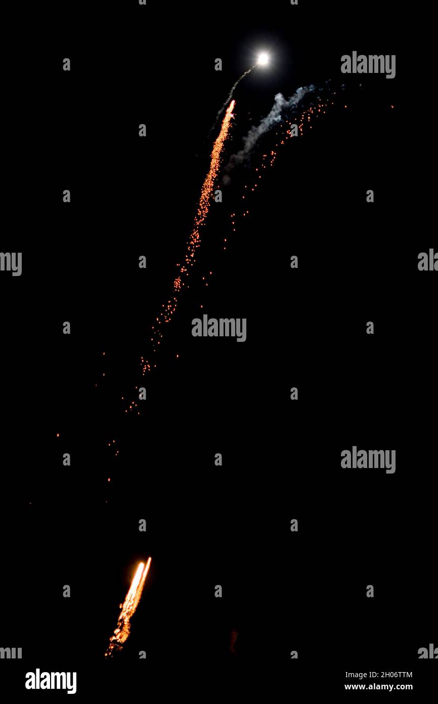 Fireworks in the night dark sky exploding with colorful glittering ...