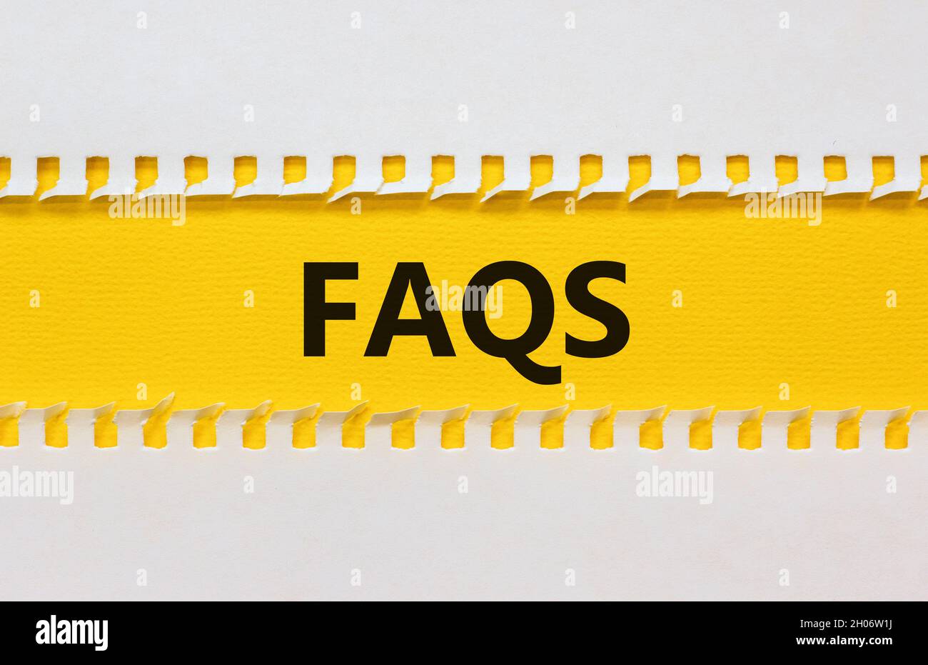 FAQS, frequently asked questions symbol. White and yellow paper. Words ...