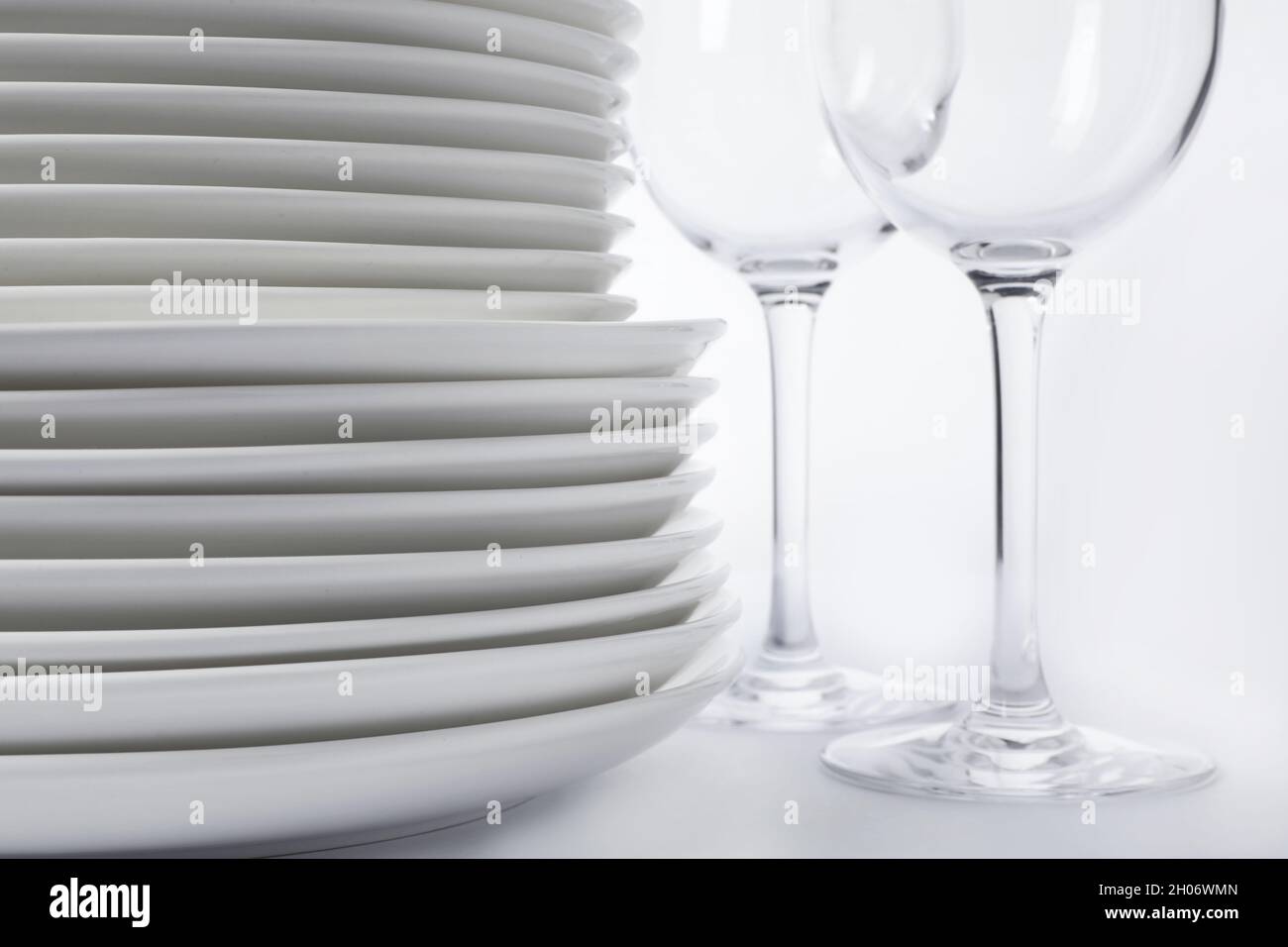 Set of clean tableware on white background, closeup. Washing dishes ...