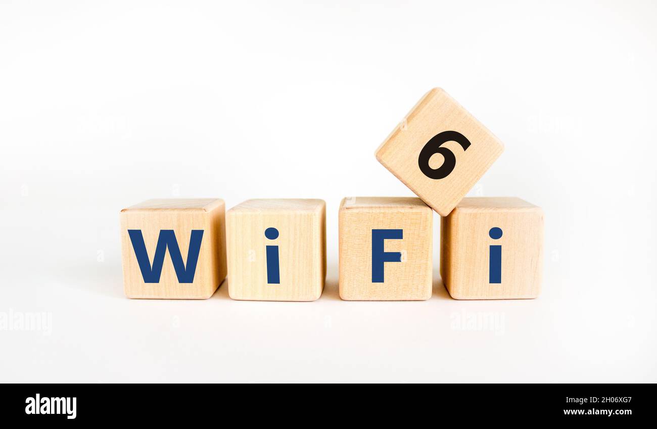 WiFi 6 symbol. The concept word WiFi 6 on wooden cubes. Beautiful white ...
