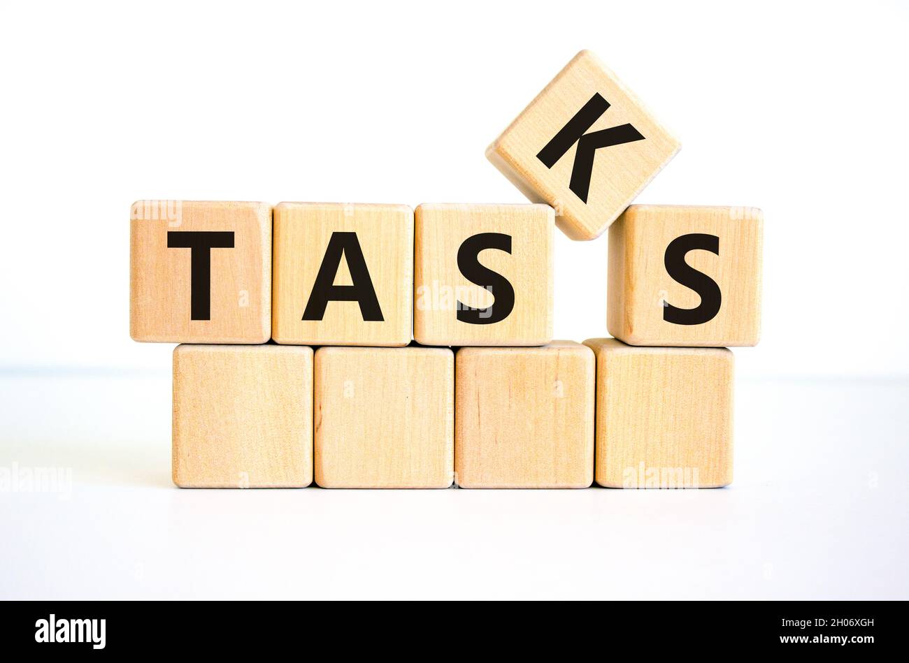 Tasks symbol. The concept word 'tasks' on wooden cubes on a beautiful ...
