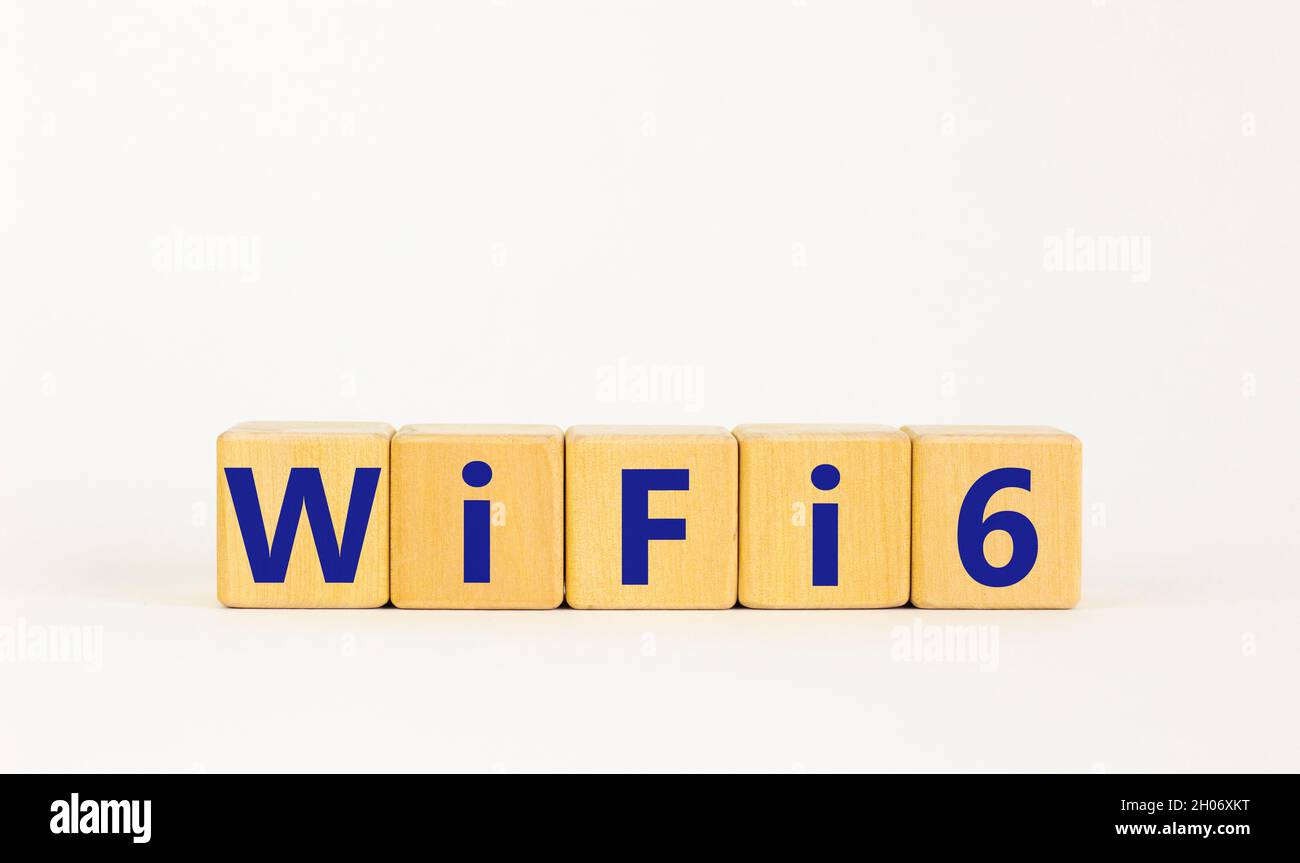 WiFi 6 symbol. The concept word WiFi 6 on wooden cubes. Beautiful white ...
