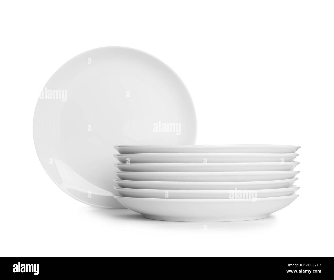 Stack of ceramic dishware on white background Stock Photo - Alamy