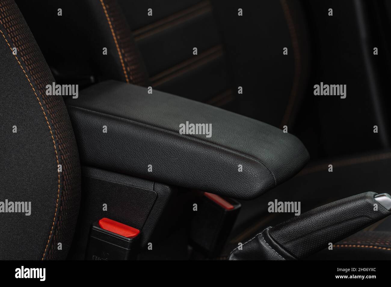 Car armrest opened. Opened armrest in the car for driver Stock Photo ...